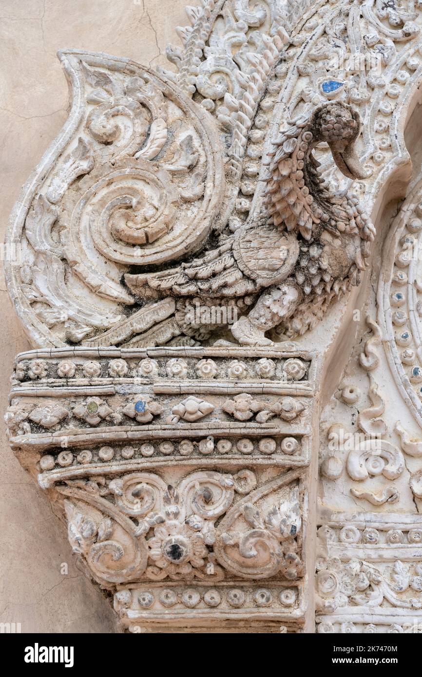 Ancient bas-relief stucco decor of a mythological swan bird around door ...