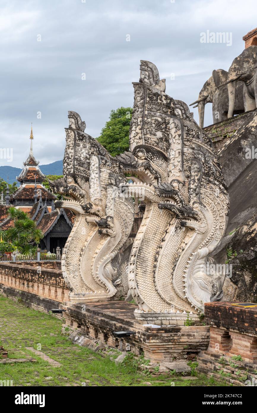Beautiful ancient stucco naga and elephant decor on main stupa at Wat ...