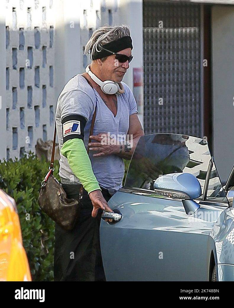 Mickey Rourke is seen entering a blue Bentley in Beverly Hills, USA ...