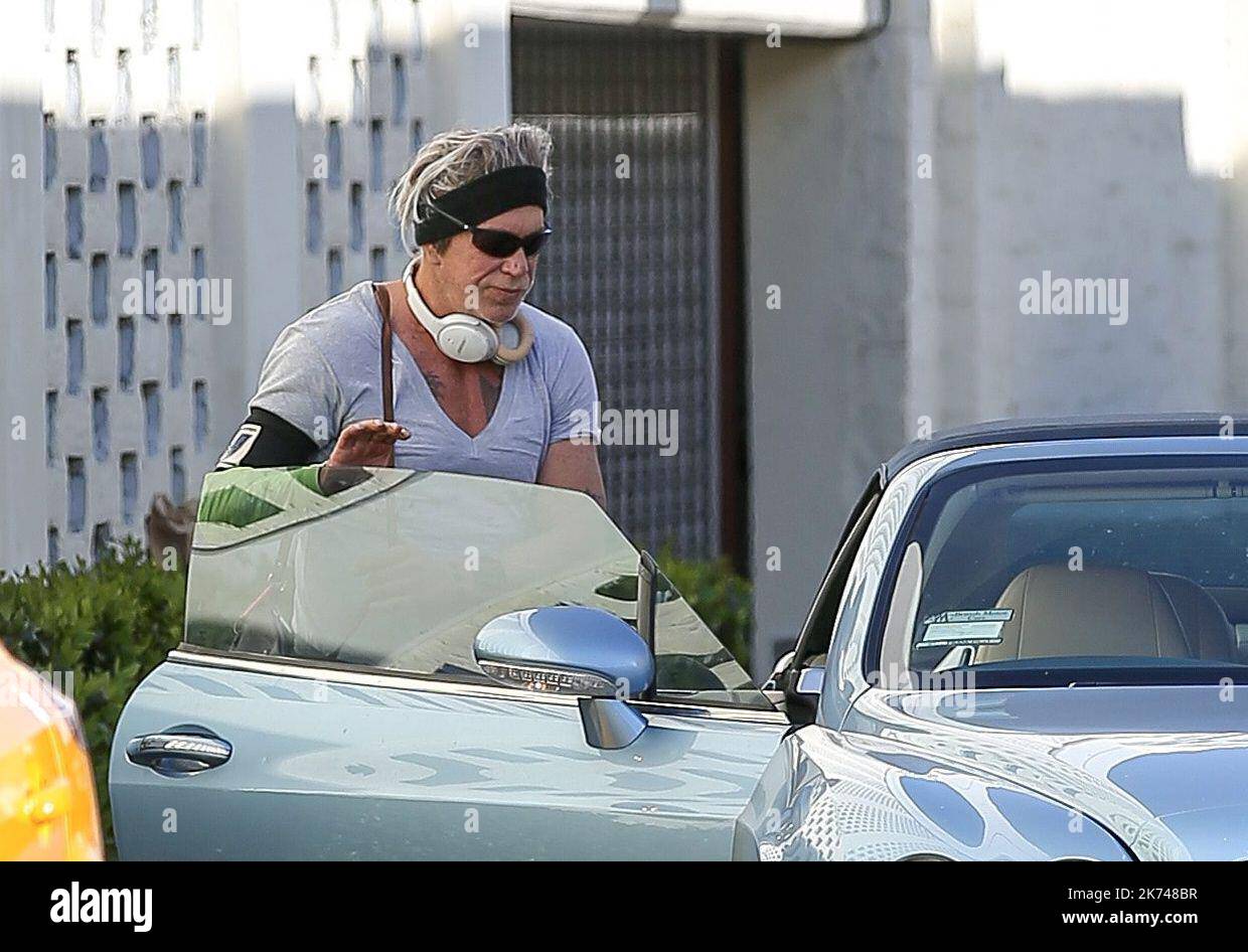 Mickey Rourke is seen entering a blue Bentley in Beverly Hills, USA ...