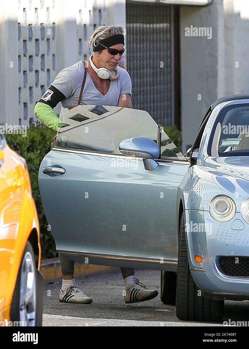 Mickey Rourke is seen entering a blue Bentley in Beverly Hills, USA ...