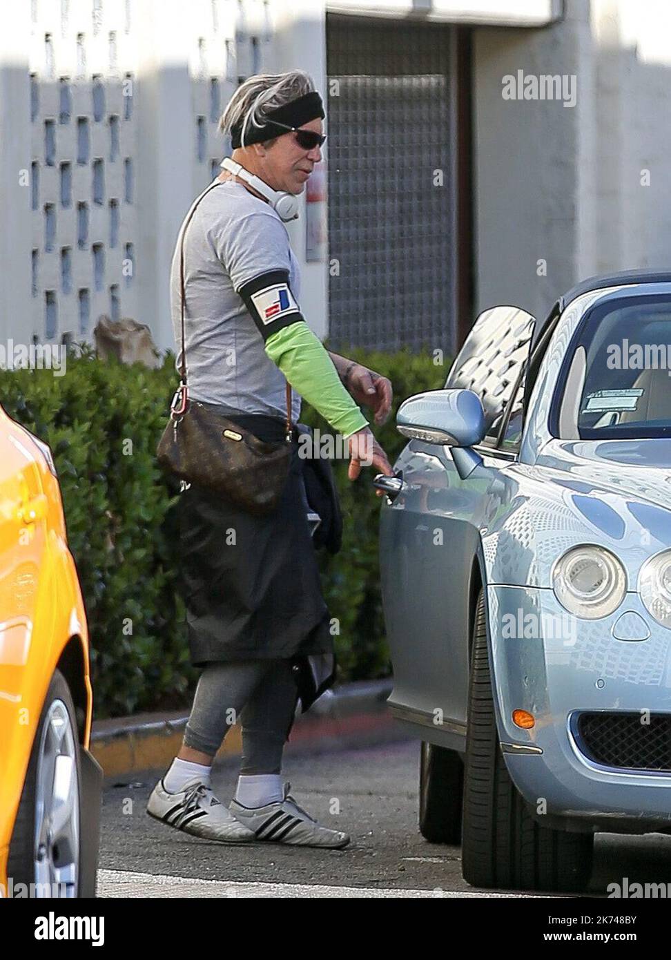 Mickey Rourke is seen entering a blue Bentley in Beverly Hills, USA ...