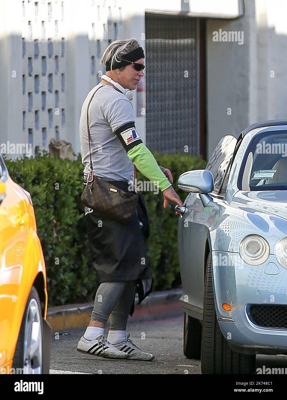 Mickey Rourke is seen entering a blue Bentley in Beverly Hills, USA ...