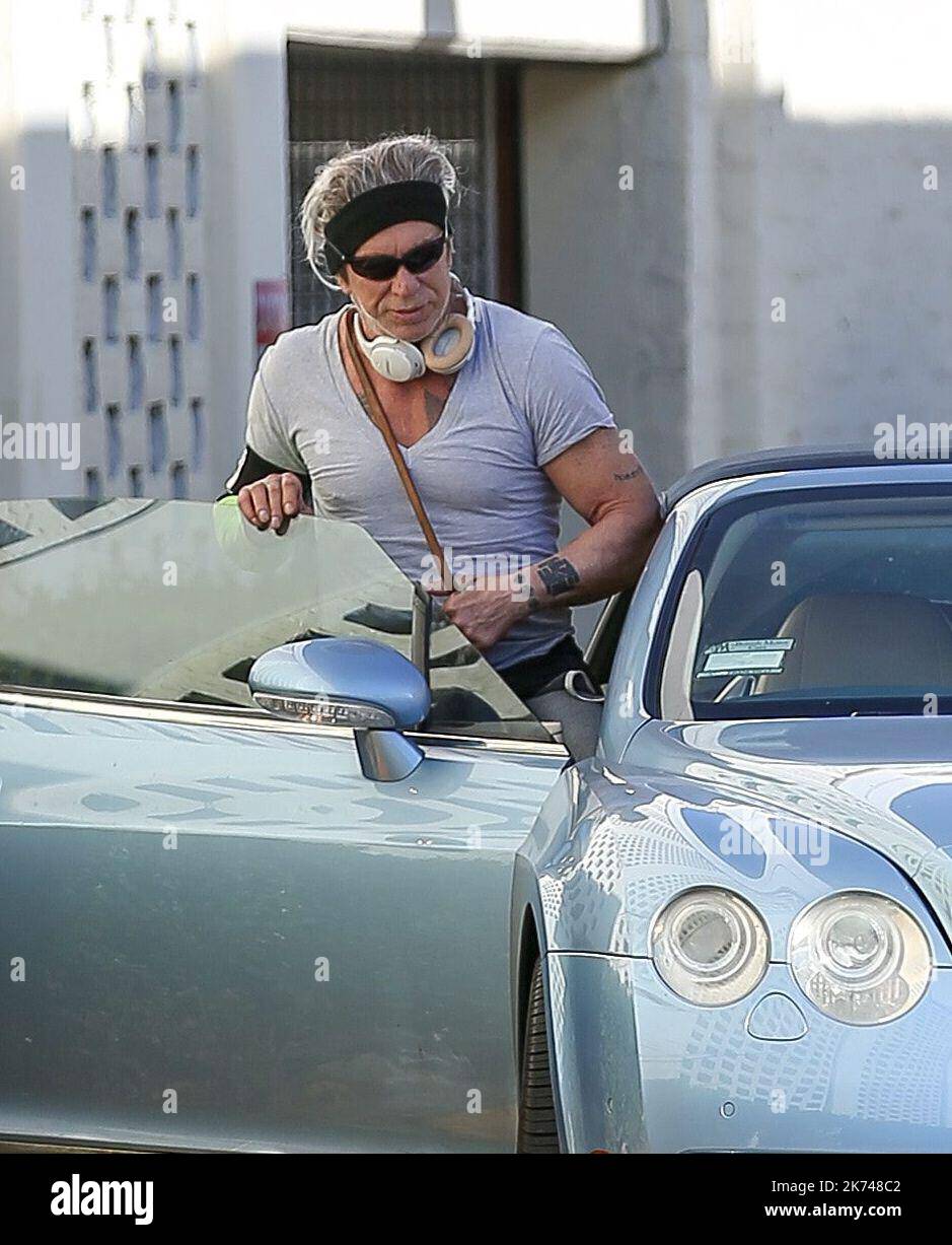 Mickey Rourke is seen entering a blue Bentley in Beverly Hills, USA ...