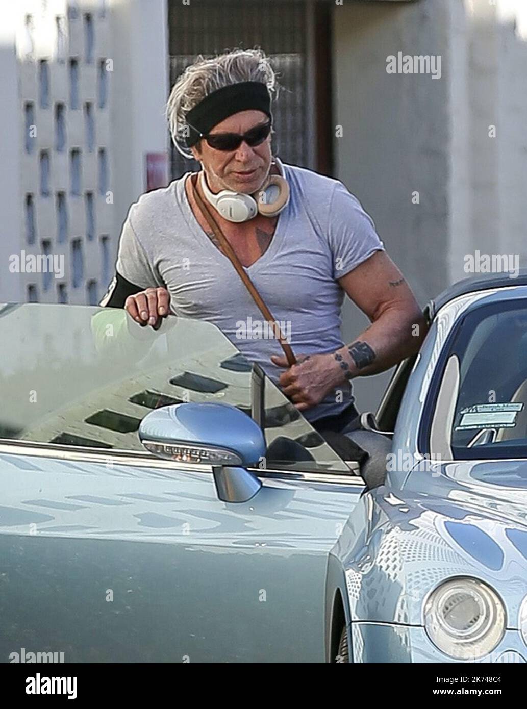 Mickey Rourke is seen entering a blue Bentley in Beverly Hills, USA ...