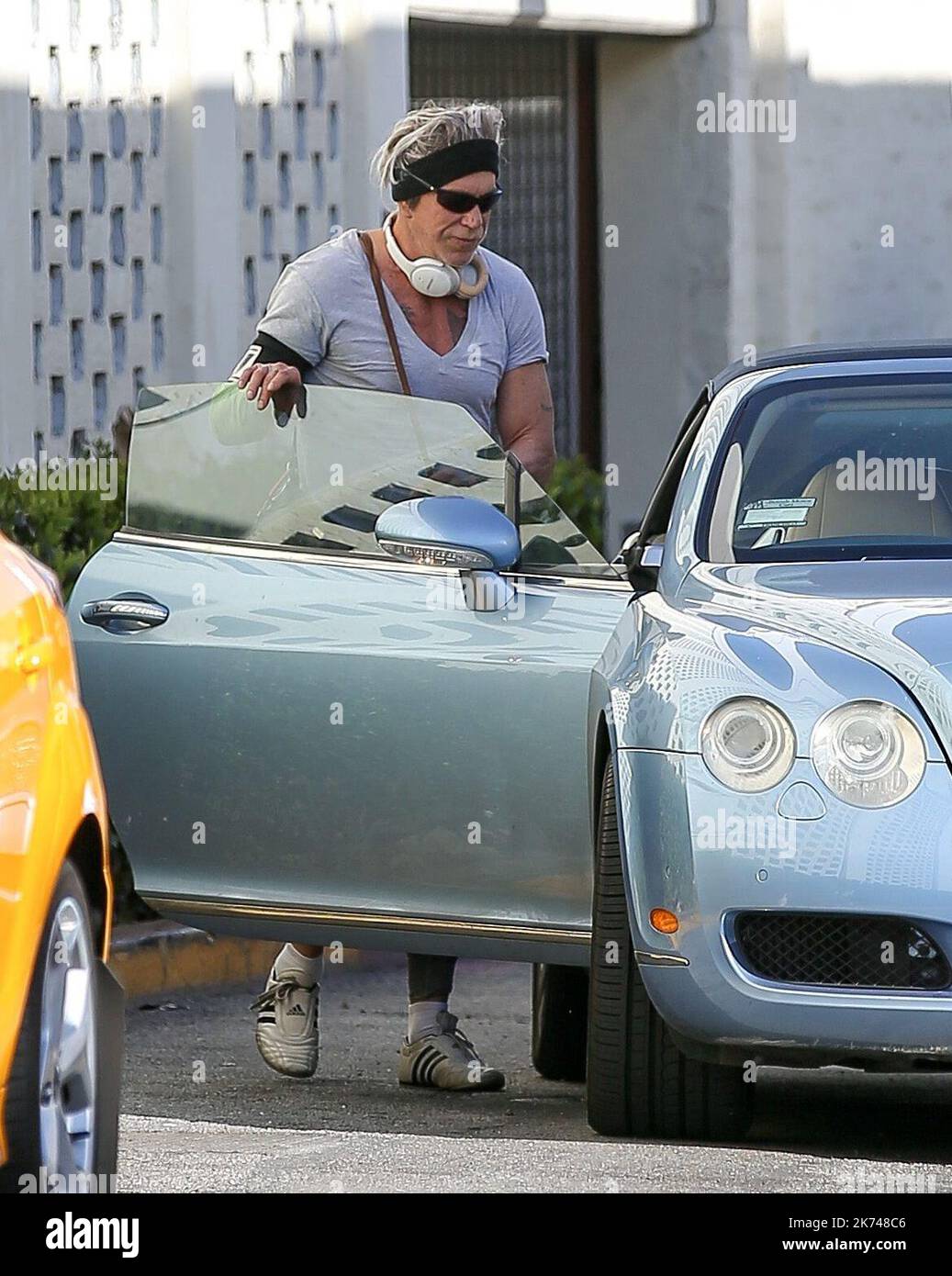 Mickey Rourke is seen entering a blue Bentley in Beverly Hills, USA ...