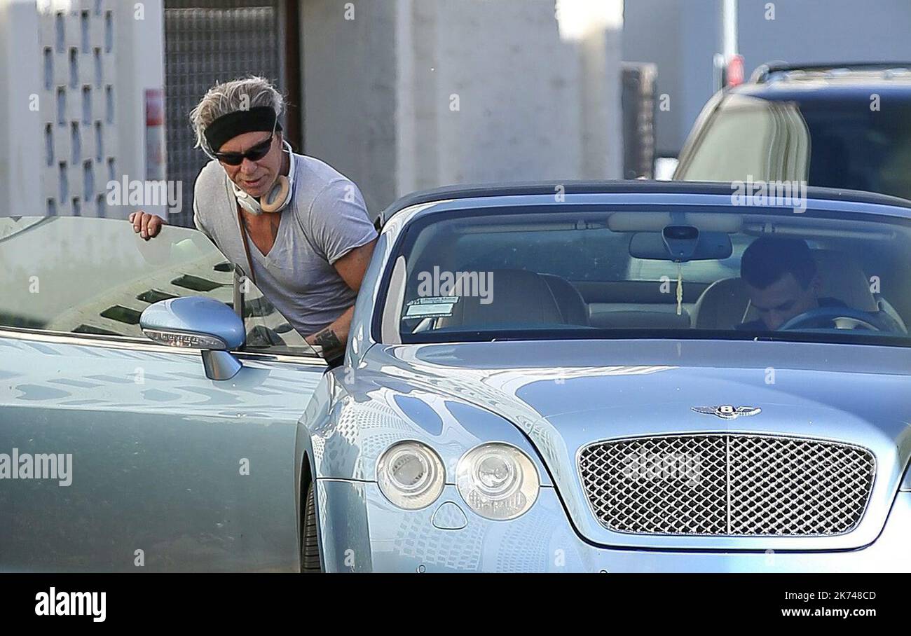 Mickey Rourke is seen entering a blue Bentley in Beverly Hills, USA ...