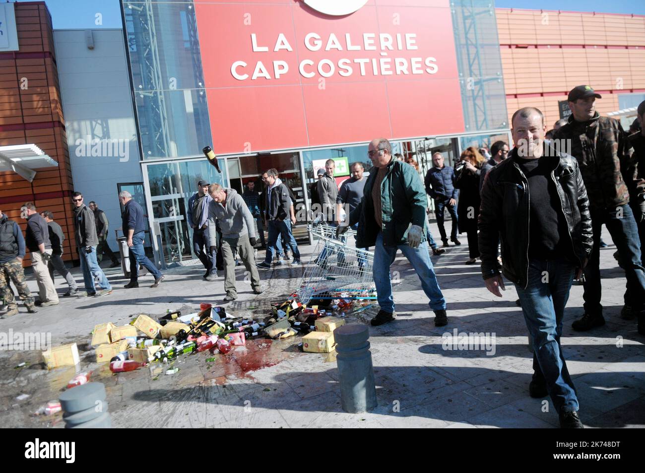 French young farmers spilled Spanish wine into a large area to protest ...
