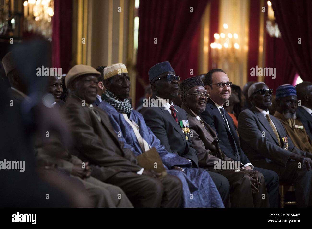 French President Francois Hollande sits during a video presentation ...