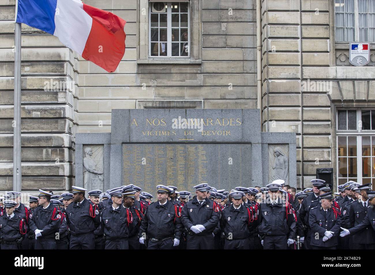 Police officers stand to attention during the National tribute to ...