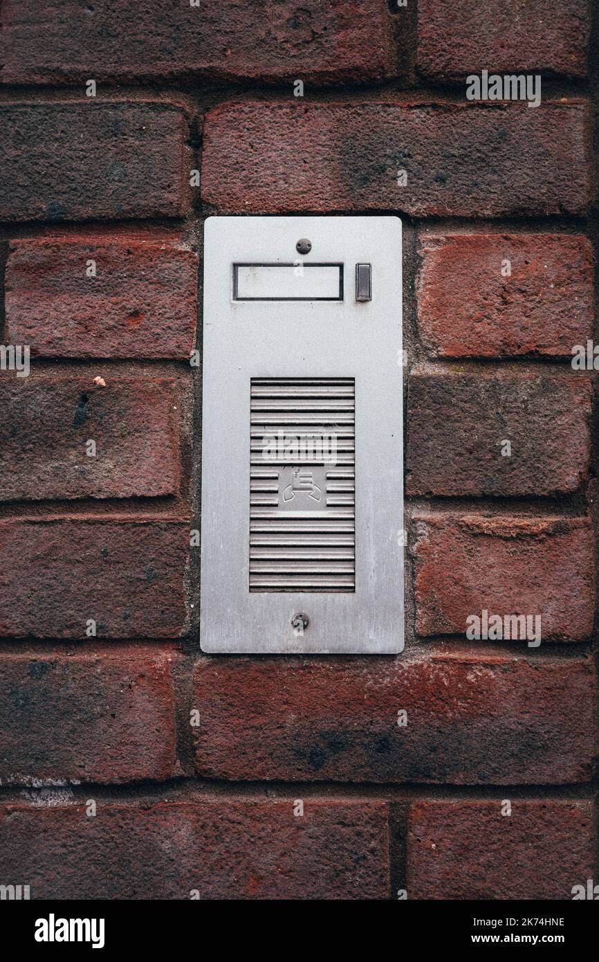 Intercom on a red brick wall Stock Photo - Alamy