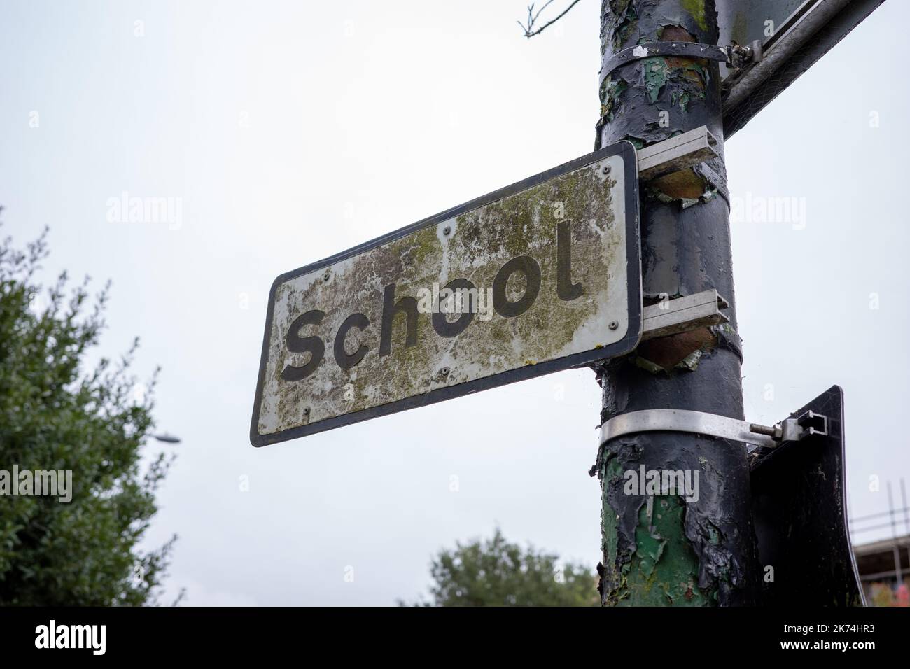 Old and weathered school sign on a lamp post, Bristol, UK Stock Photo ...