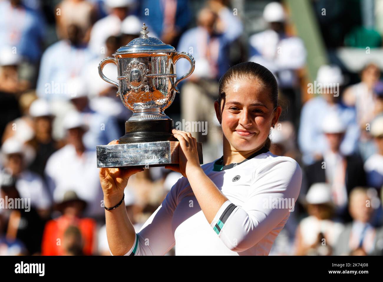 Jelena Ostapenko of Latvia poses with the championship trophy after ...