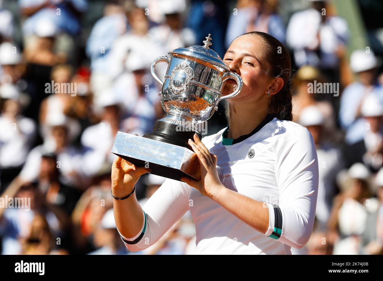 Jelena Ostapenko of Latvia poses with the championship trophy after ...