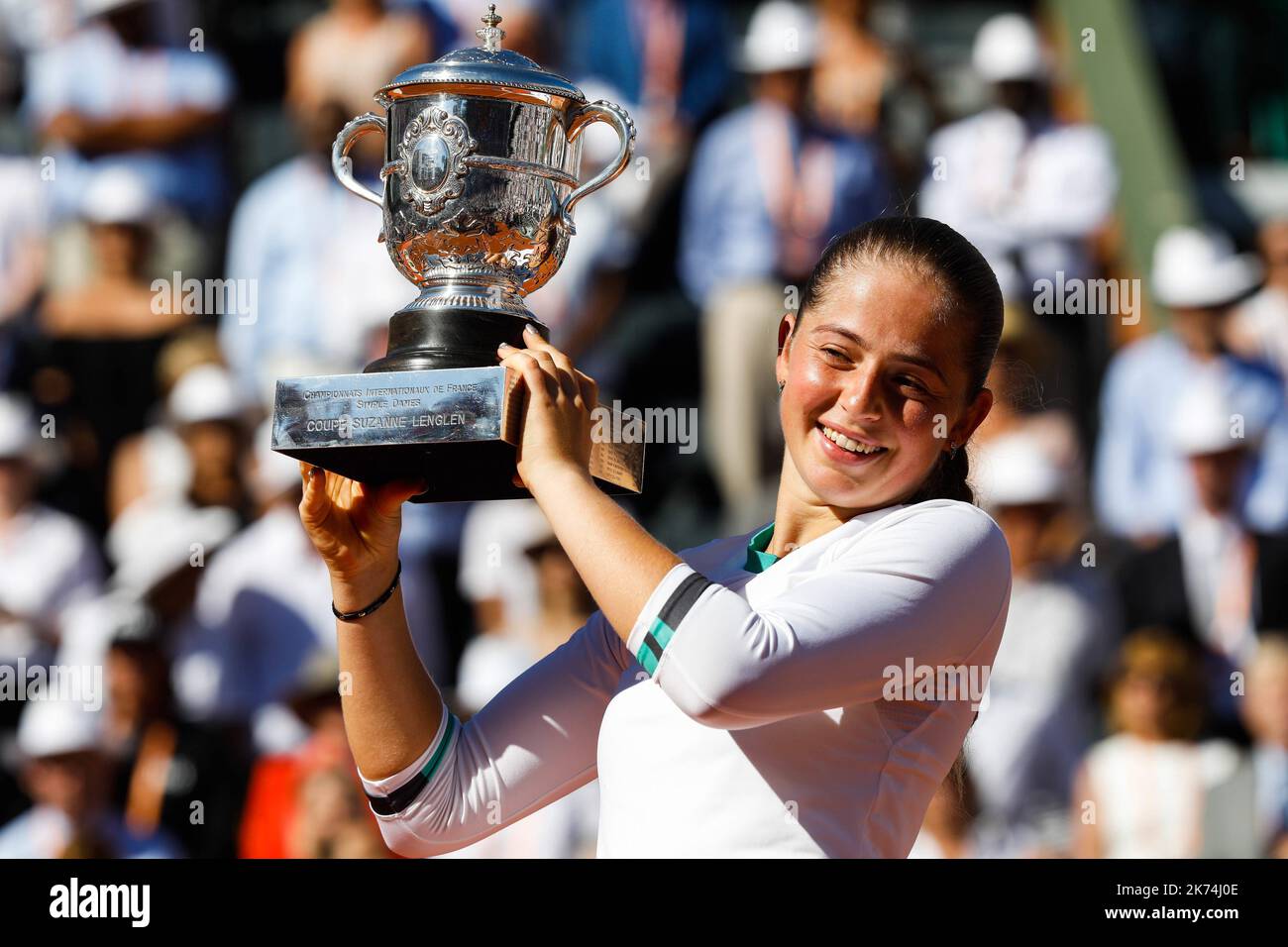 Jelena Ostapenko of Latvia poses with the championship trophy after ...