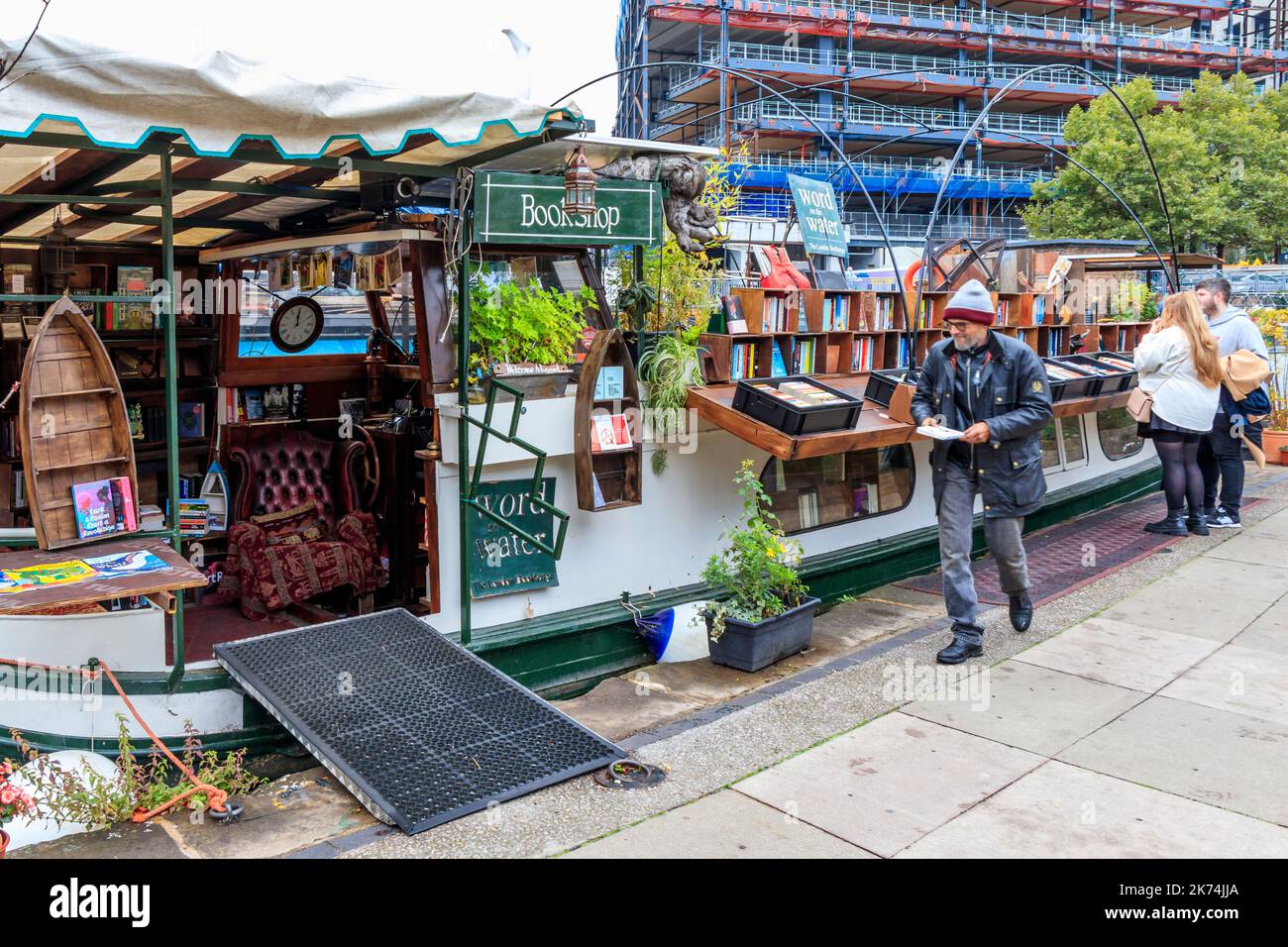 Customers browsing at Word On The Water, aka The London Bookbarge, a ...