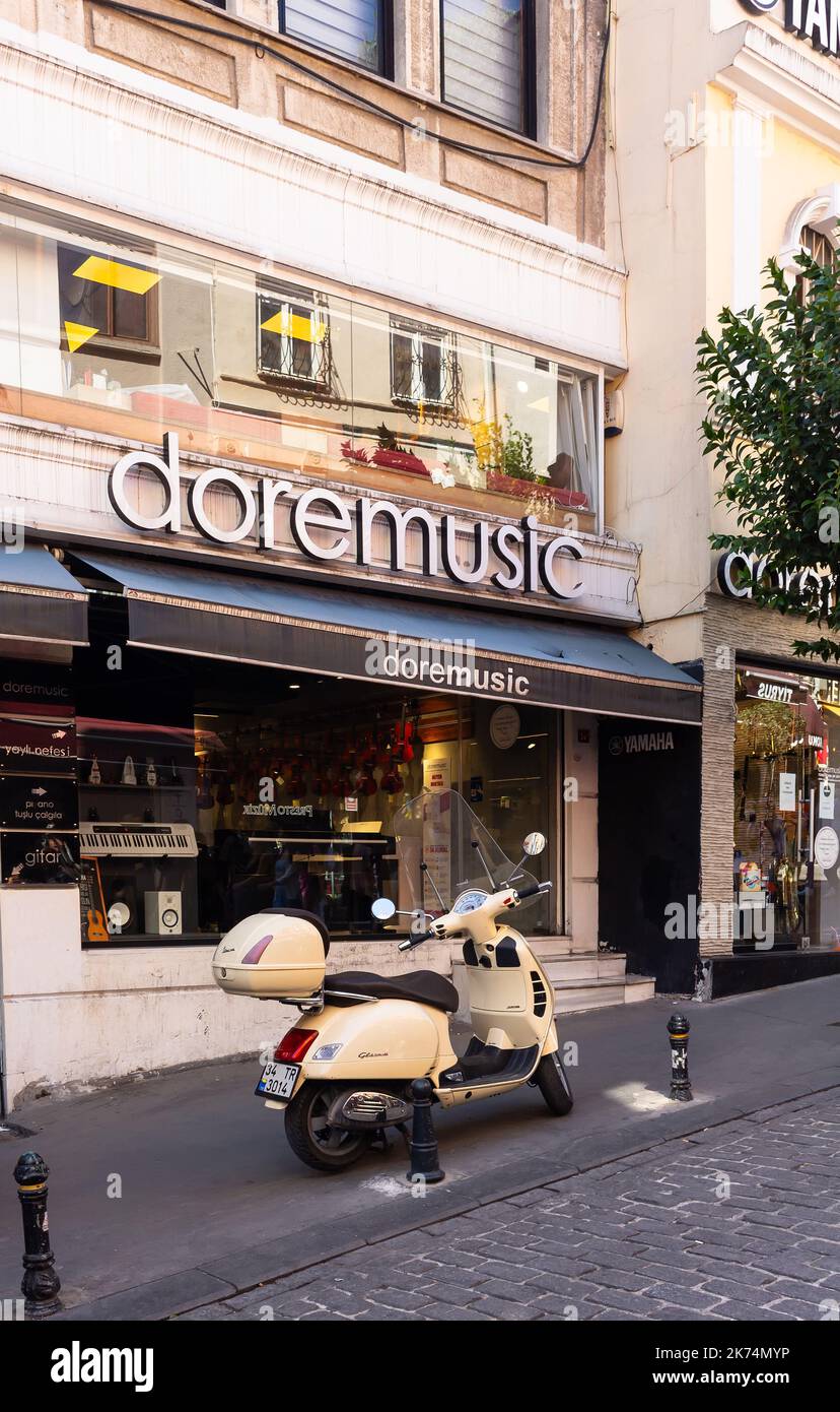 View of a motorcycle parked in front of music store on one of the ...