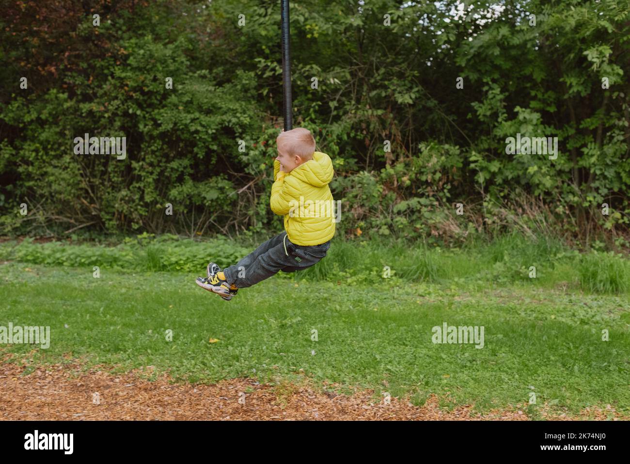 Kid Bungee jumping in the Autumn Forest Stock Photo - Alamy