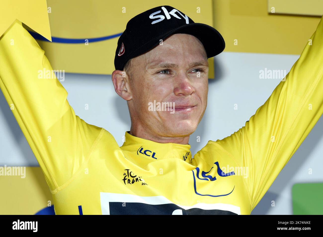 Christopher FROOME of Team Sky celebrates with the yellow jersey on the ...