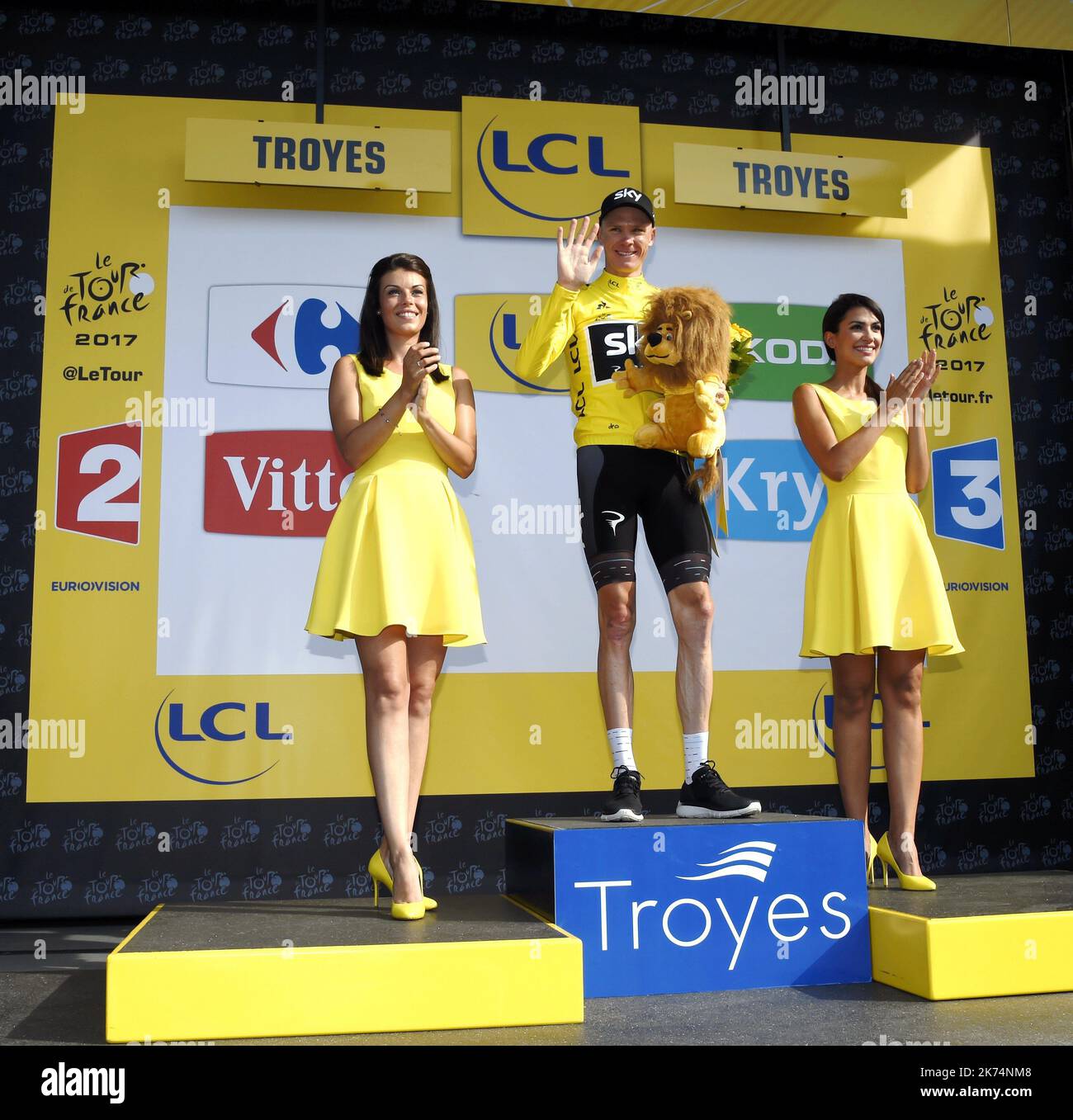 Christopher FROOME of Team Sky celebrates with the yellow jersey on the ...