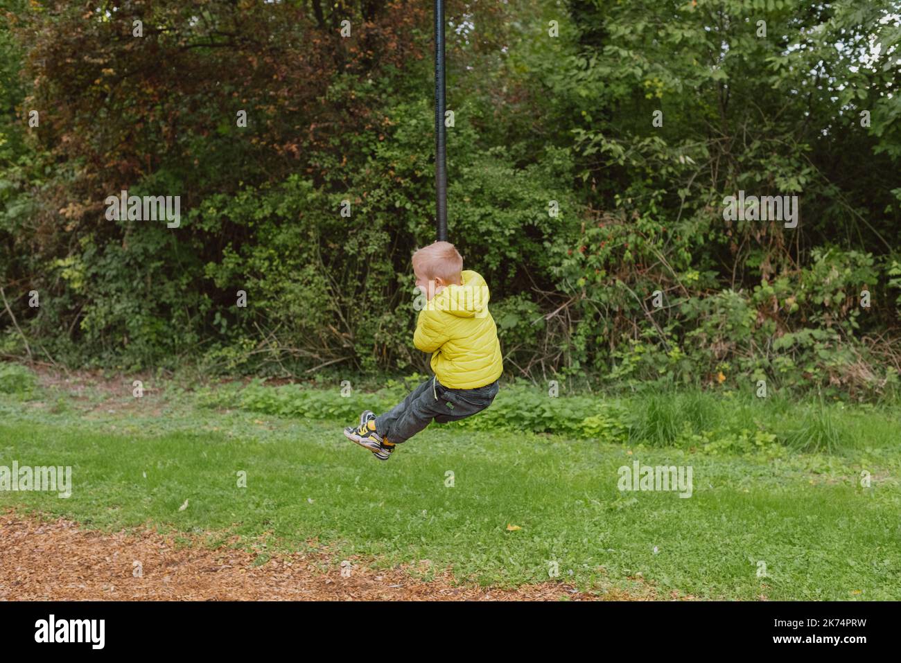 Kid Bungee jumping in the Autumn Forest Stock Photo - Alamy