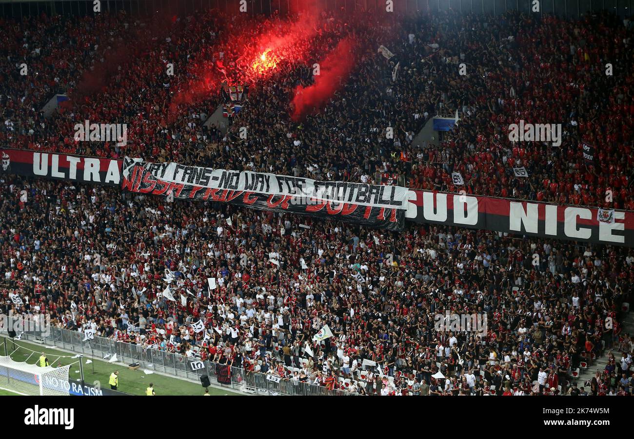 Fans in the stands light flares Stock Photo - Alamy