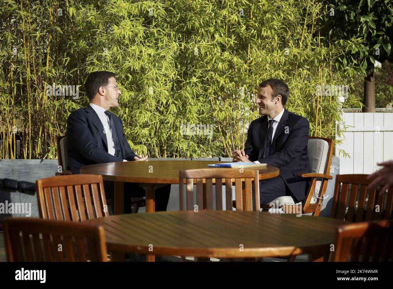 French President Emmanuel Macron (R) speaks with Dutch Prime Minister ...