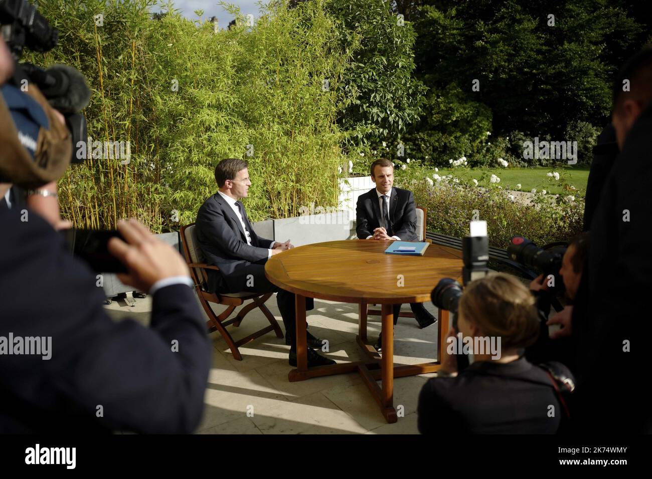 French President Emmanuel Macron (R) speaks with Dutch Prime Minister ...