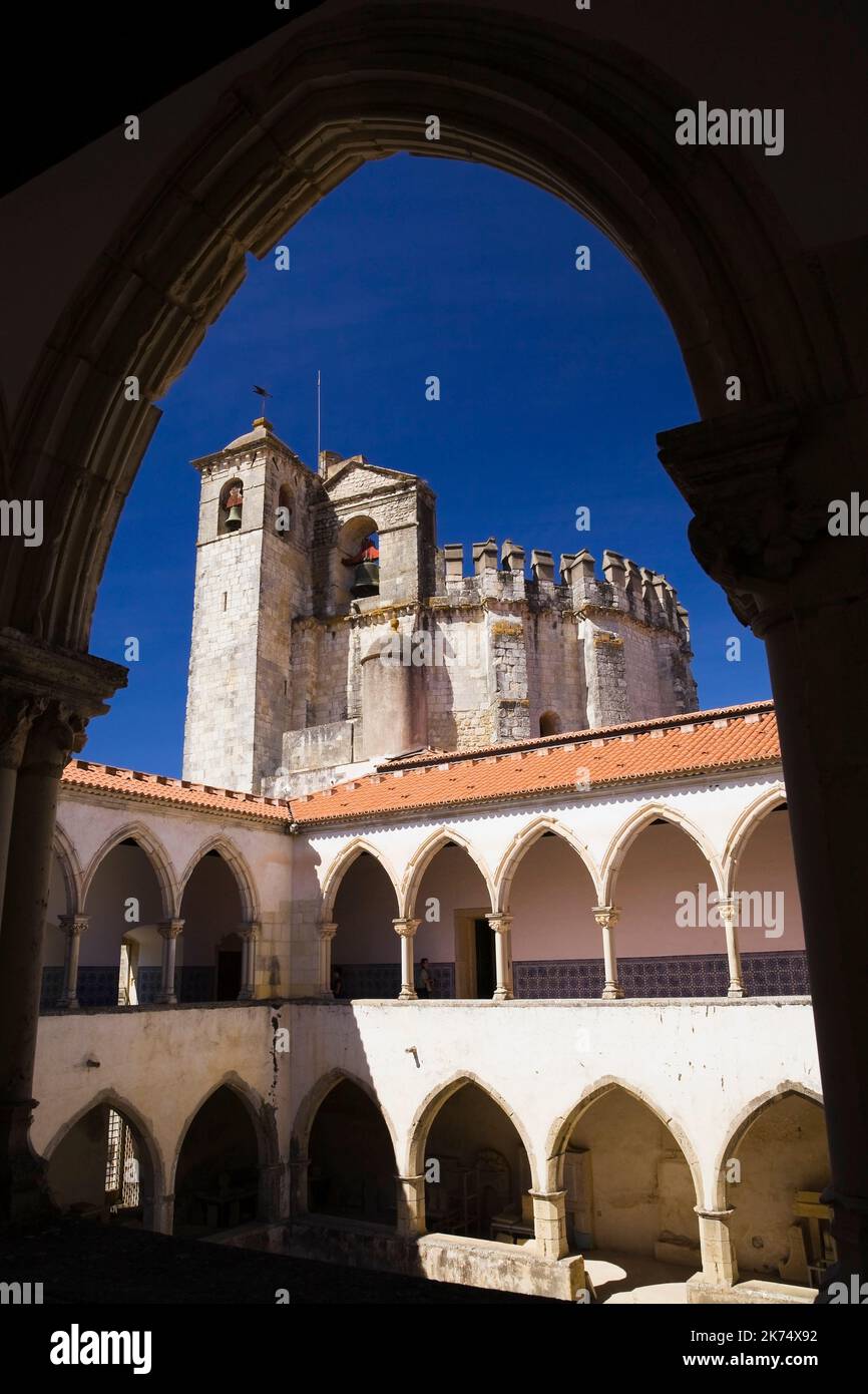 Inner courtyard at the Convent of Christ through silhouetted arch ...