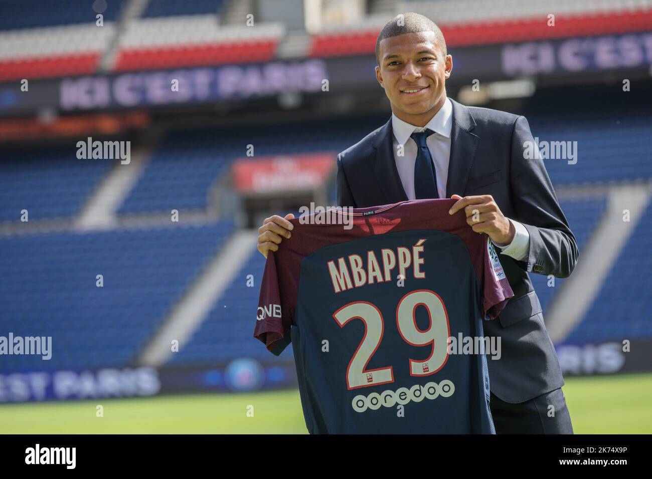 Paris Saint-Germain's new forward Kylian Mbappe (right) poses with his ...