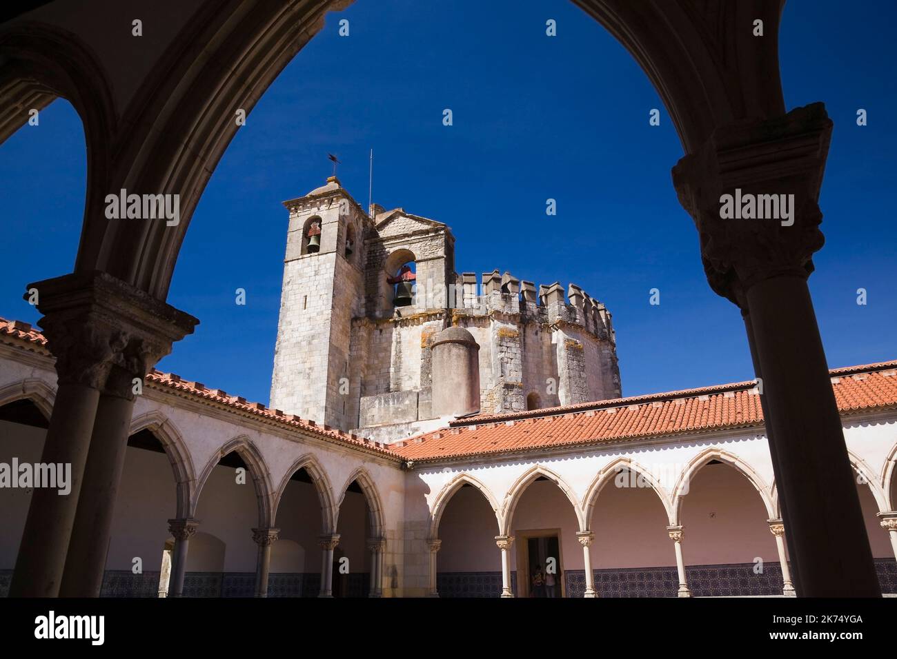 Inner courtyard at the Convent of Christ through silhouetted arch ...