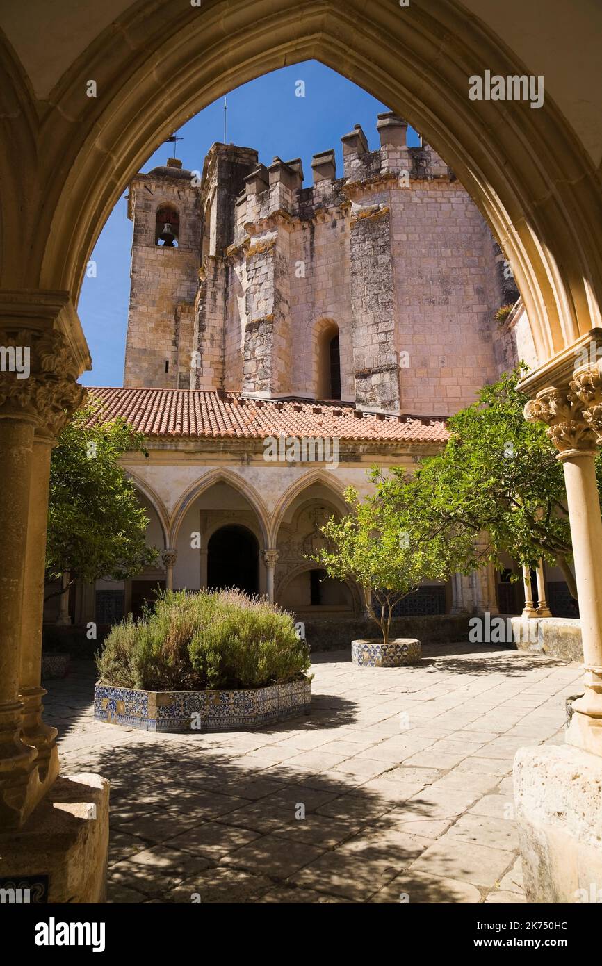 Inner courtyard framed through arch at the Convent of Christ, Tomar ...