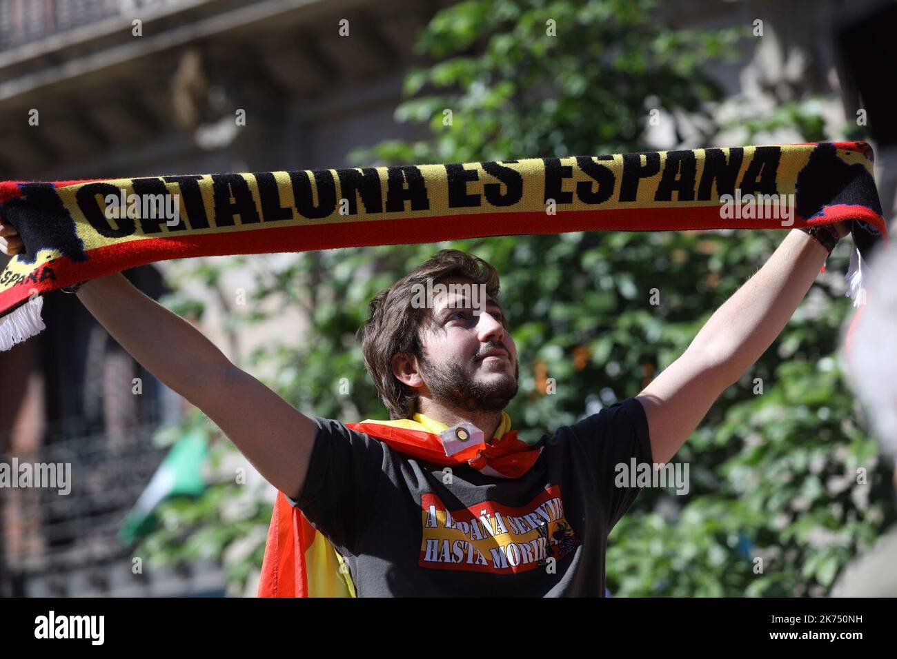 Thousands of people protest with Catalonian and Spanish flags against ...
