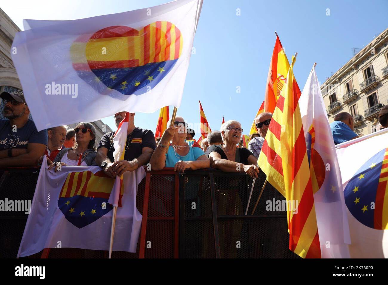 Thousands of people protest with Catalonian and Spanish flags against ...