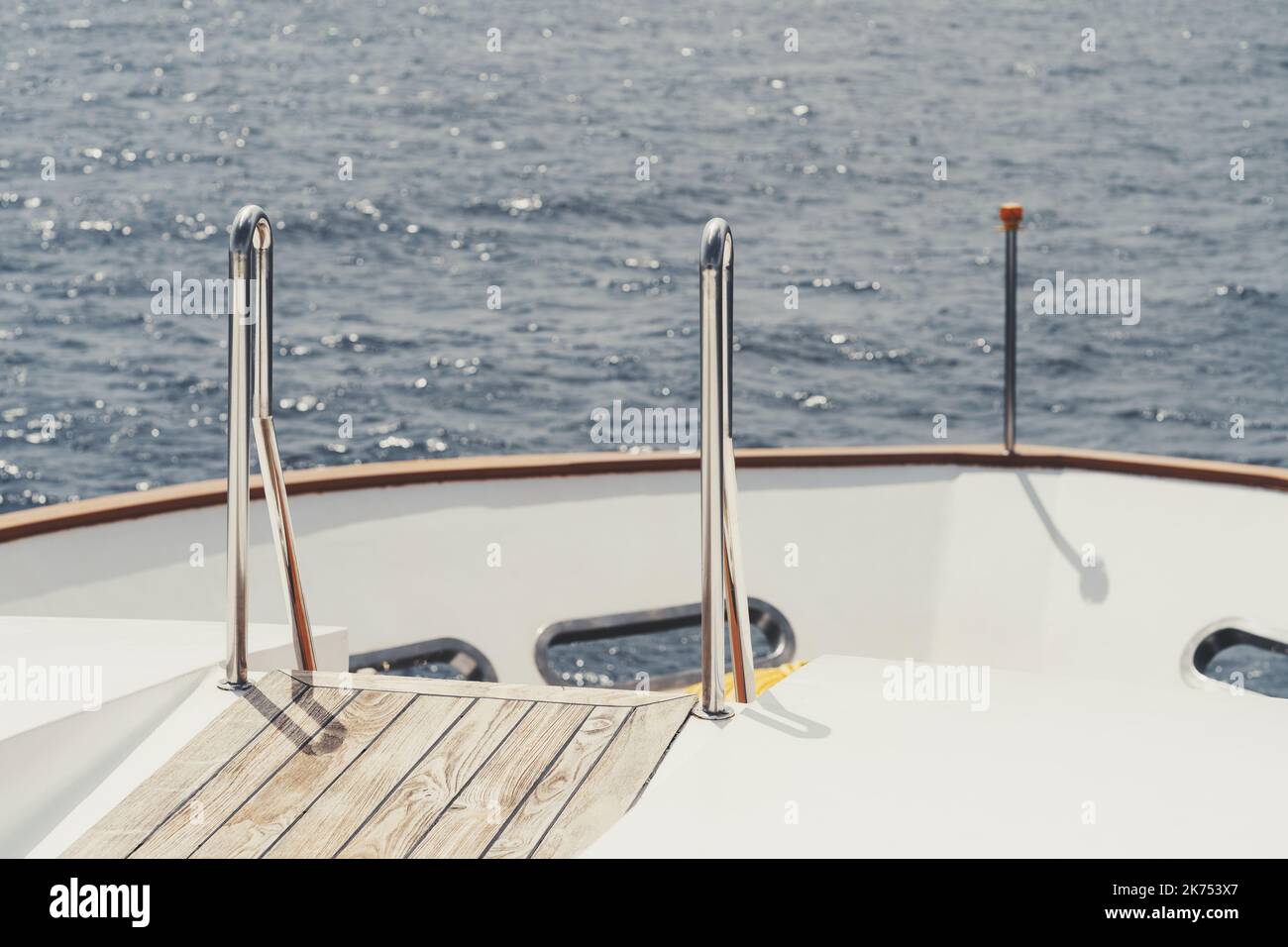View from a yacht stern of a part of the bow of the boat with a ...