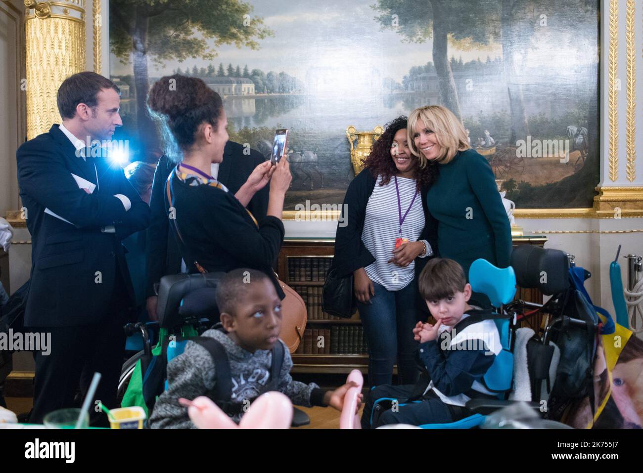 French President Emmanuel Macron and his wife Brigitte attend the ...