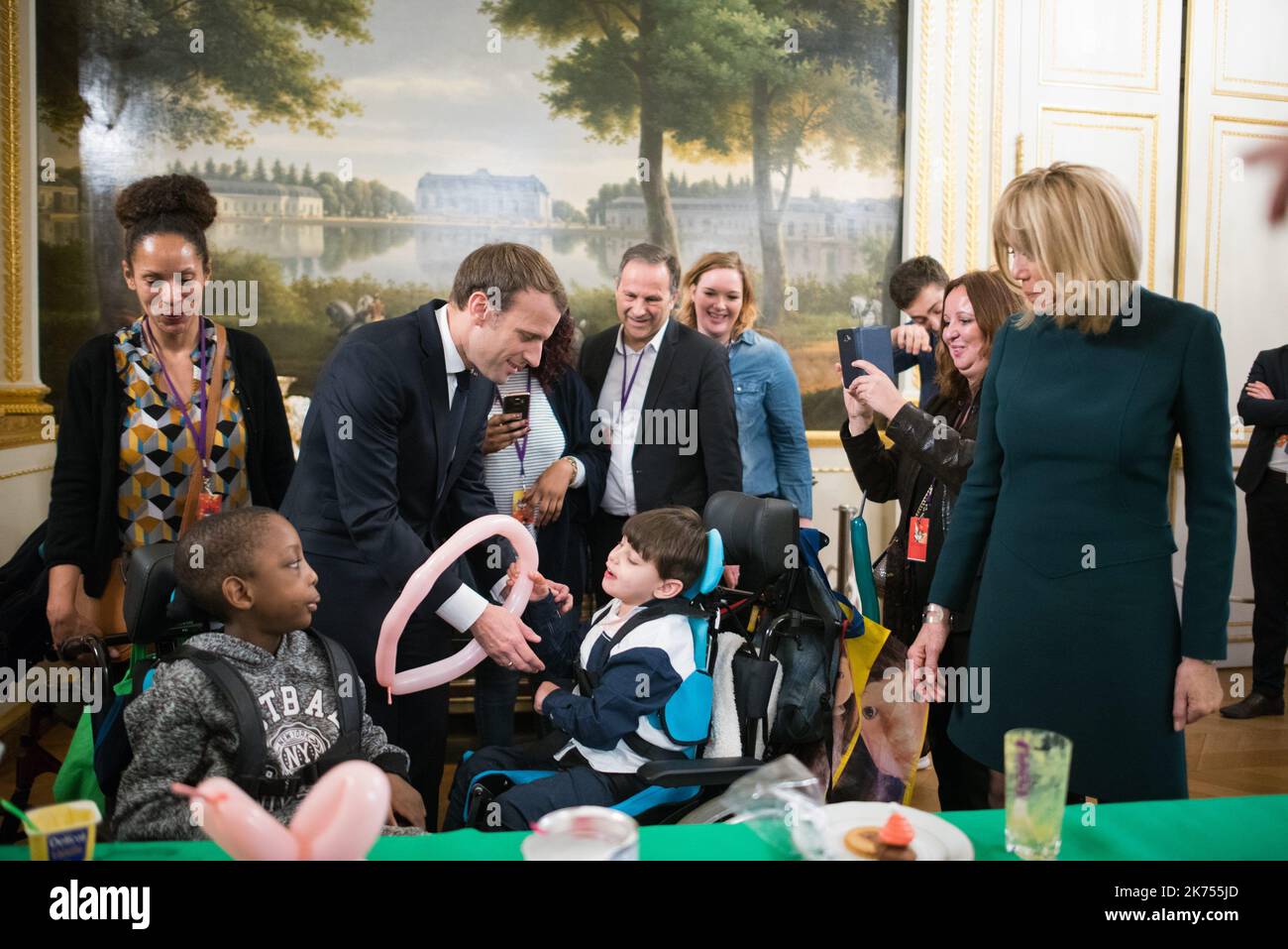 French President Emmanuel Macron and his wife Brigitte attend the ...