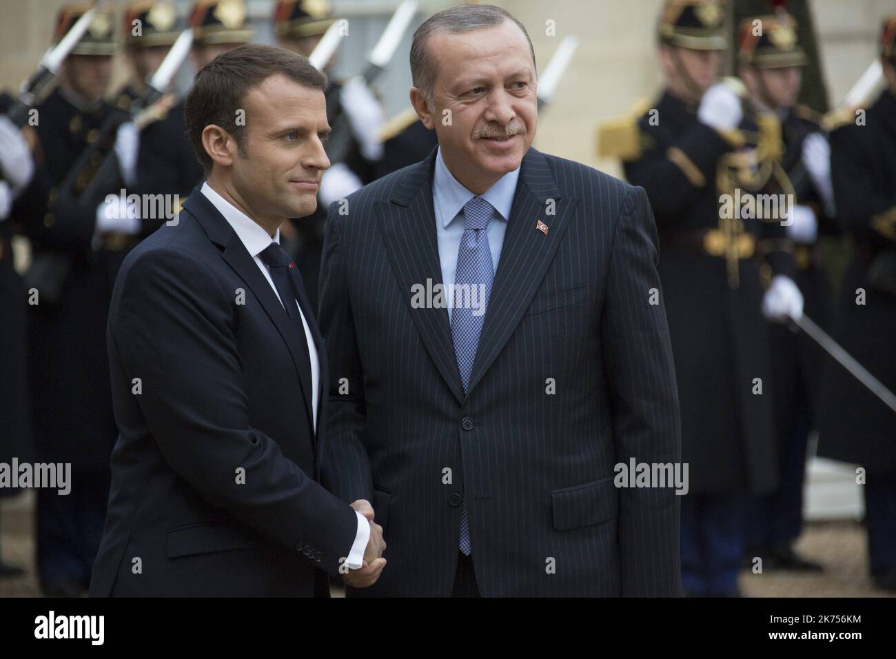 Turkish President Recep Tayyip Erdogan, right, is welcomed by French ...