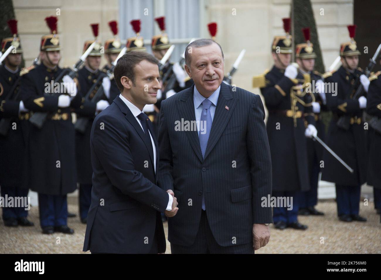 Turkish President Recep Tayyip Erdogan, right, is welcomed by French ...