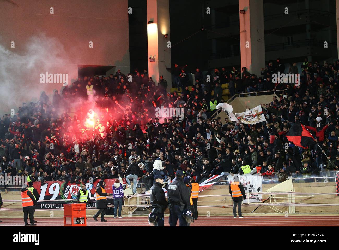 Fans let off flares in the stands Stock Photo - Alamy