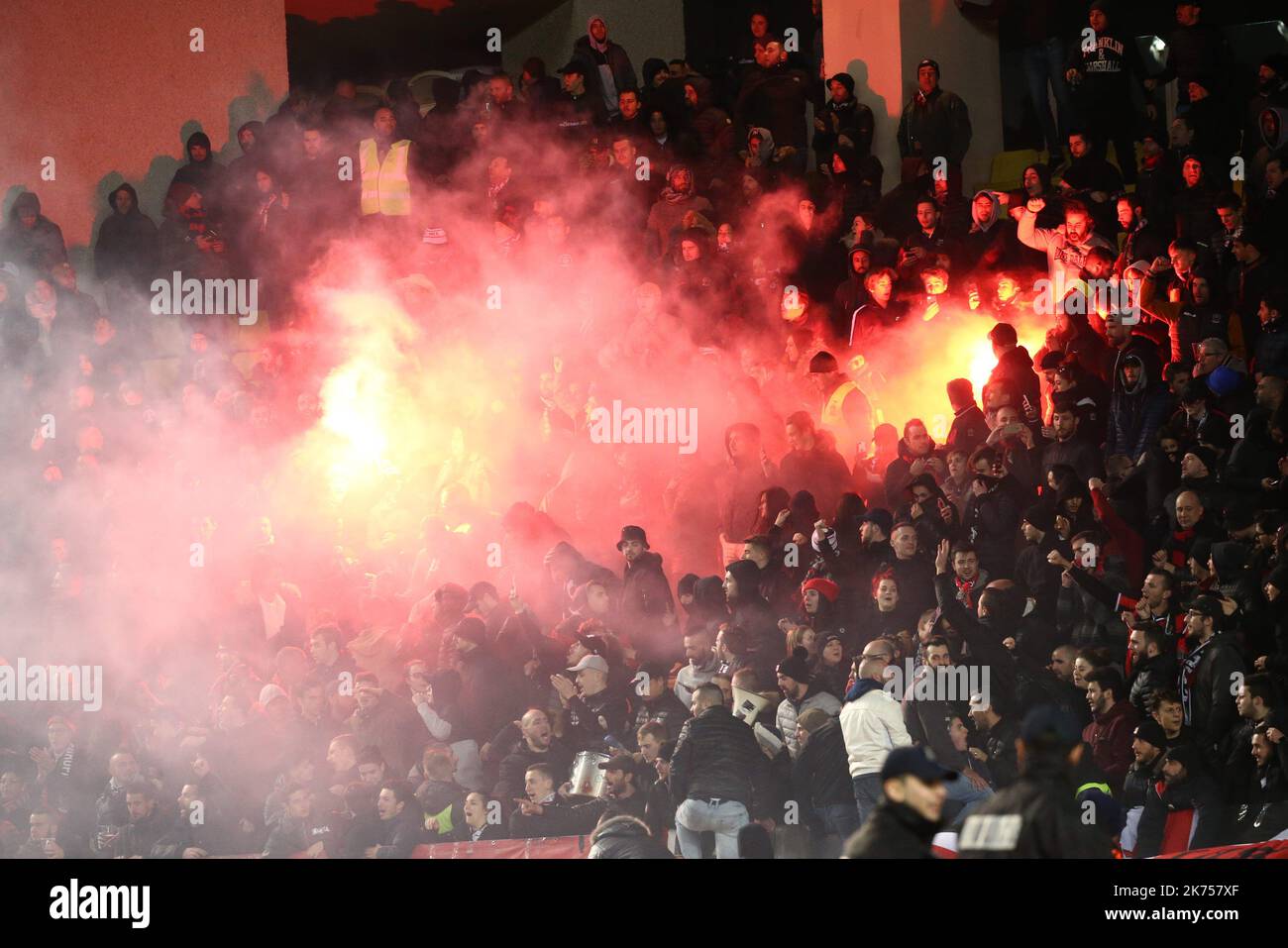 Fans let off flares in the stands Stock Photo - Alamy