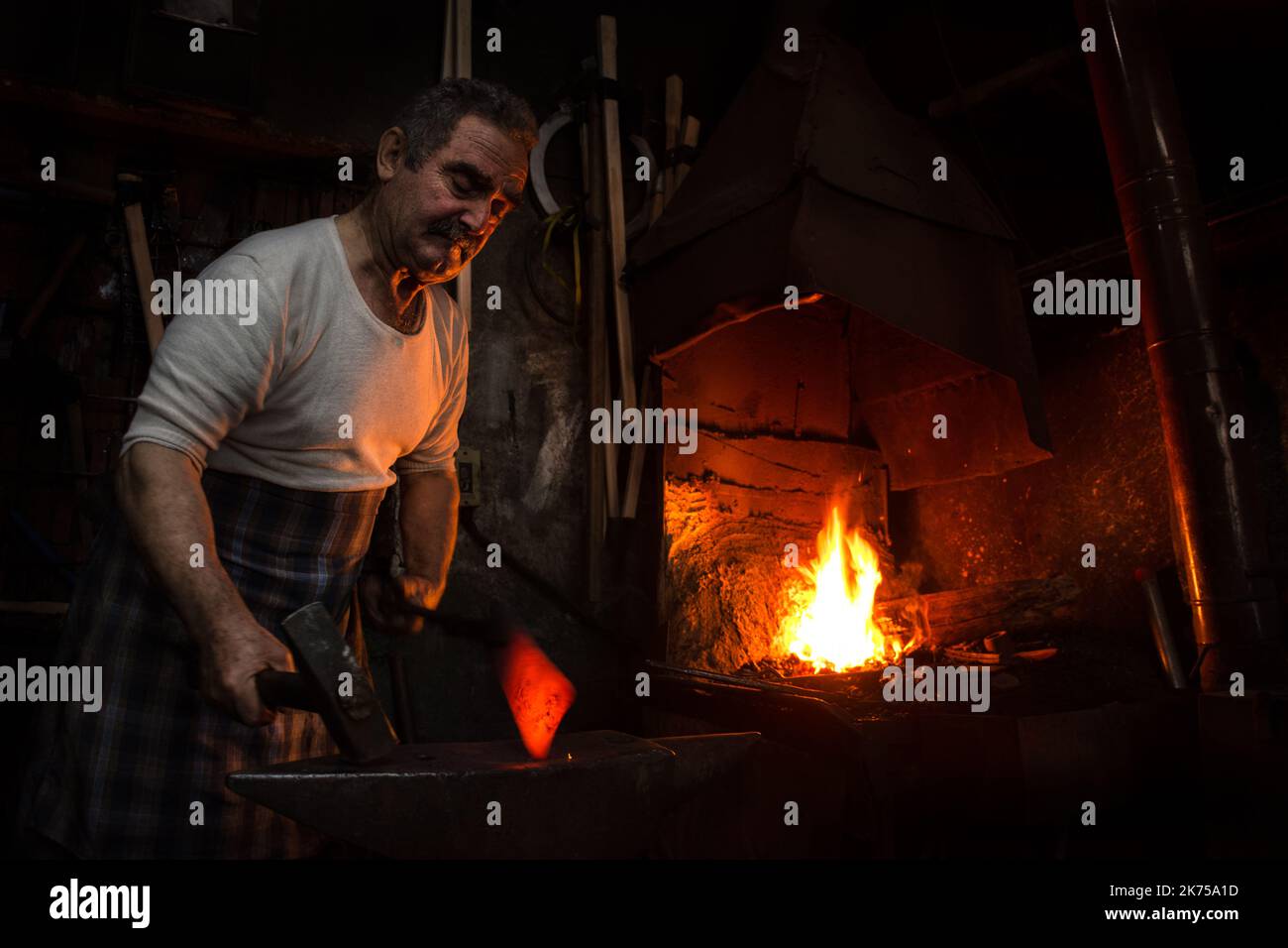 Blacksmith Working with His Tools Stock Photo - Alamy