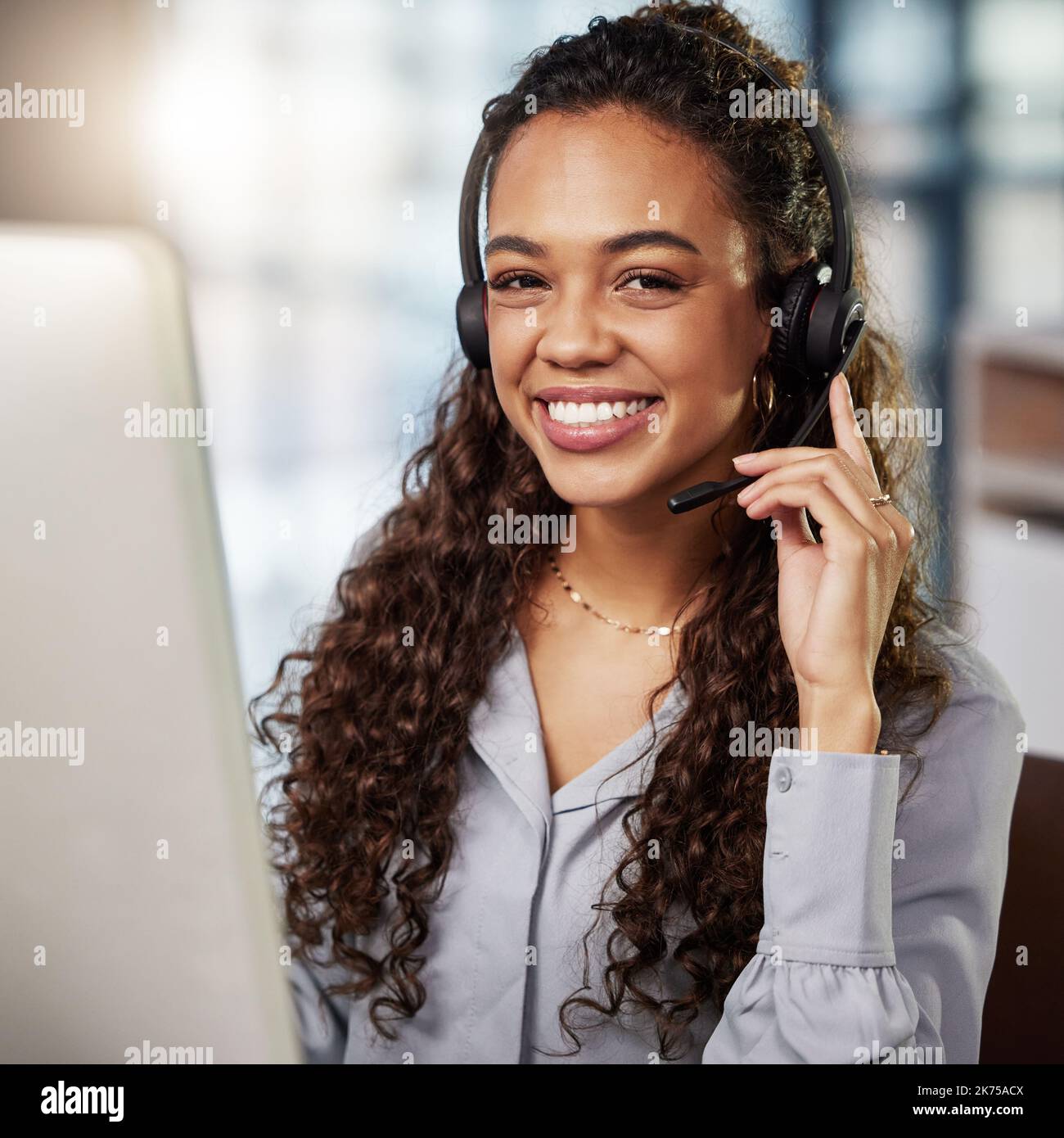 Ready to help and serve. a young businesswoman working in a call center ...