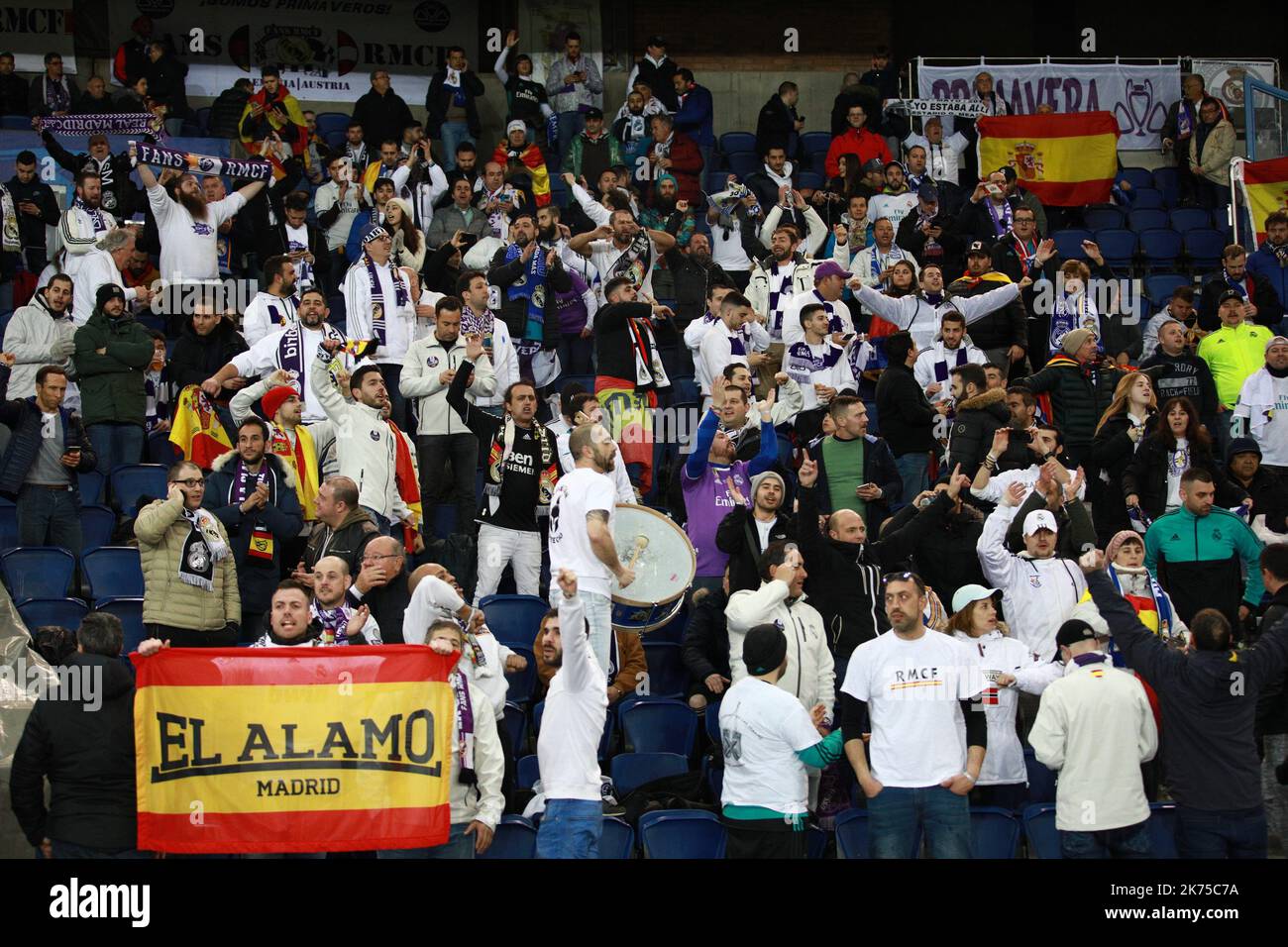 Real Madrid fans in the stands wave flags and banners to show their ...