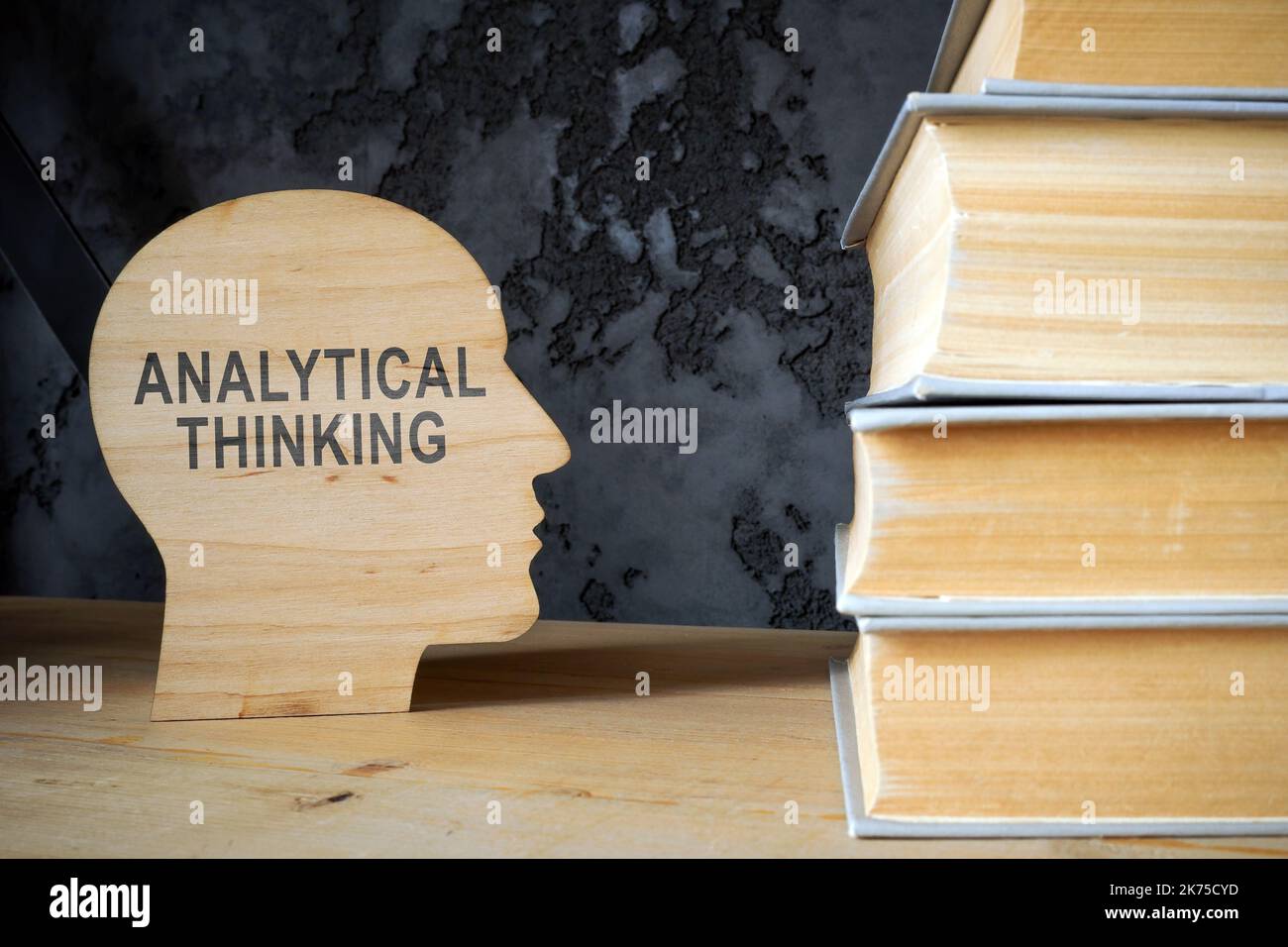 Head with inscription analytical thinking and books Stock Photo - Alamy