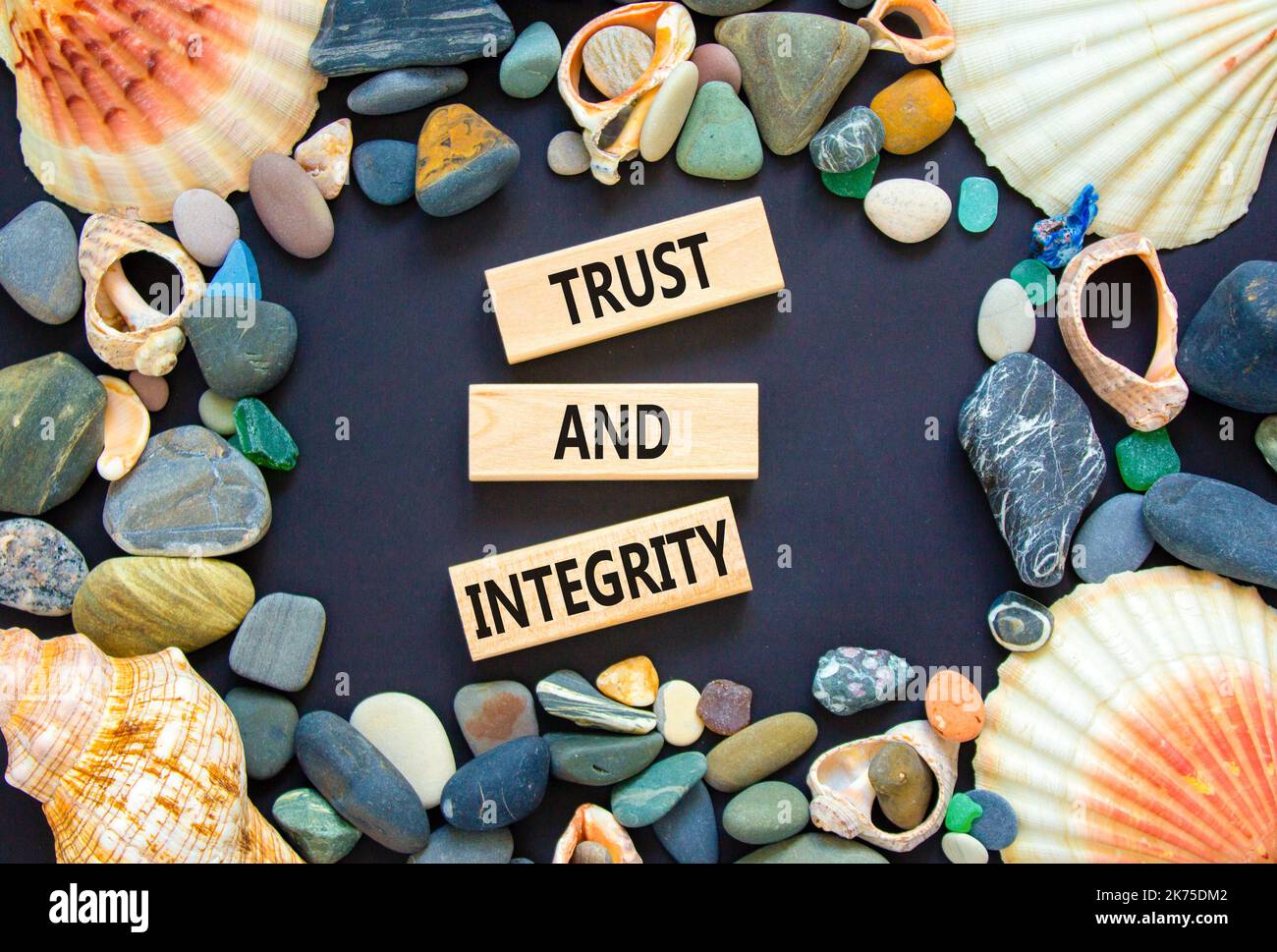 Trust and integrity symbol. Concept words Trust and integrity on wooden ...