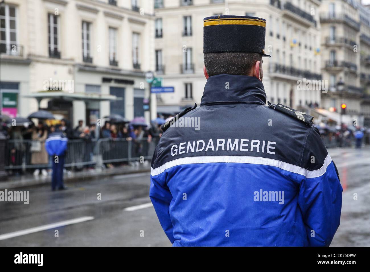 French gendarme gather to watch as the coffin of the late Lieutenant ...