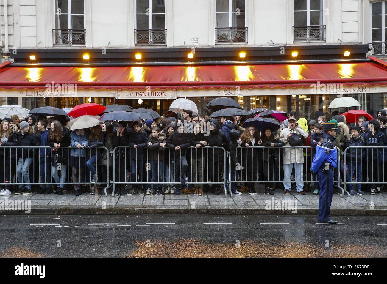 People gather to watch as the coffin of the late Lieutenant Colonel ...