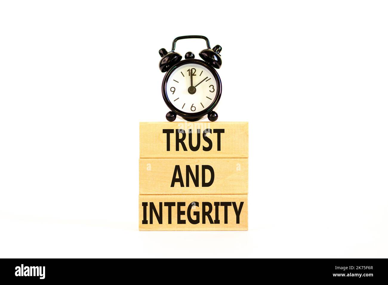 Trust and integrity symbol. Concept words Trust and integrity on wooden ...