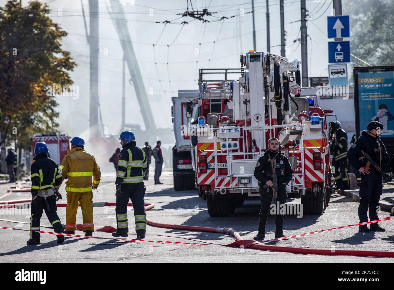 Kyiv, Ukraine. 17th Oct, 2022. Ukrainian firefighters work at the site ...